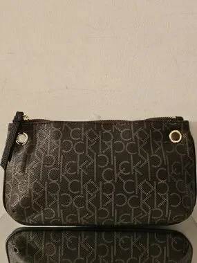Calvin Klein | Bags | Calvin Klein Brown Monogram Logo Wristlet Clutch ...